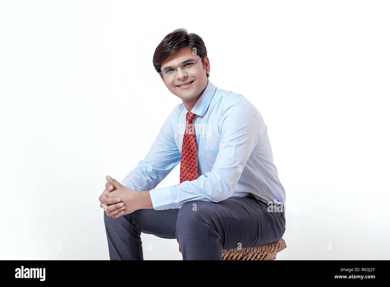 Young Indian businessman over white background Stock Photo - Alamy