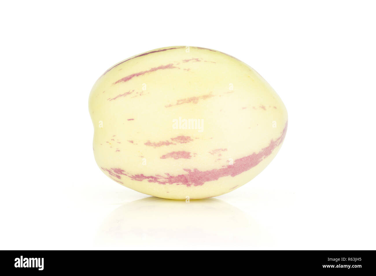 One whole ripe fresh striped pepino melon isolated on white background ...