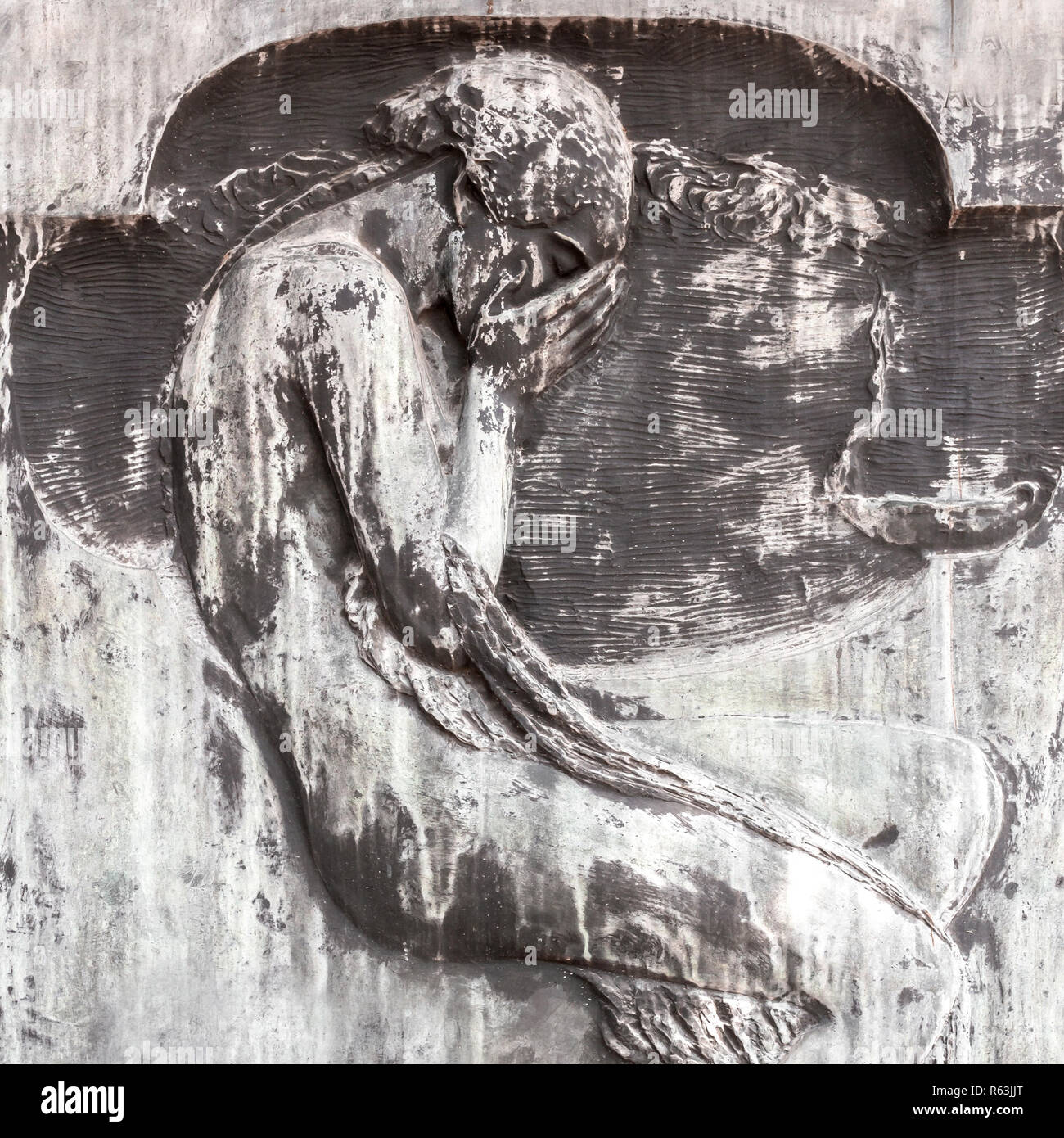 Carved of weeping man Stock Photo - Alamy