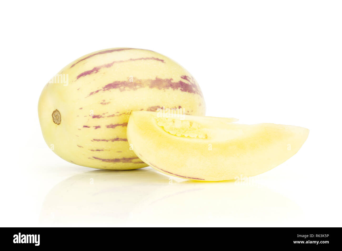 Group of one whole one slice of ripe fresh striped pepino melon ...