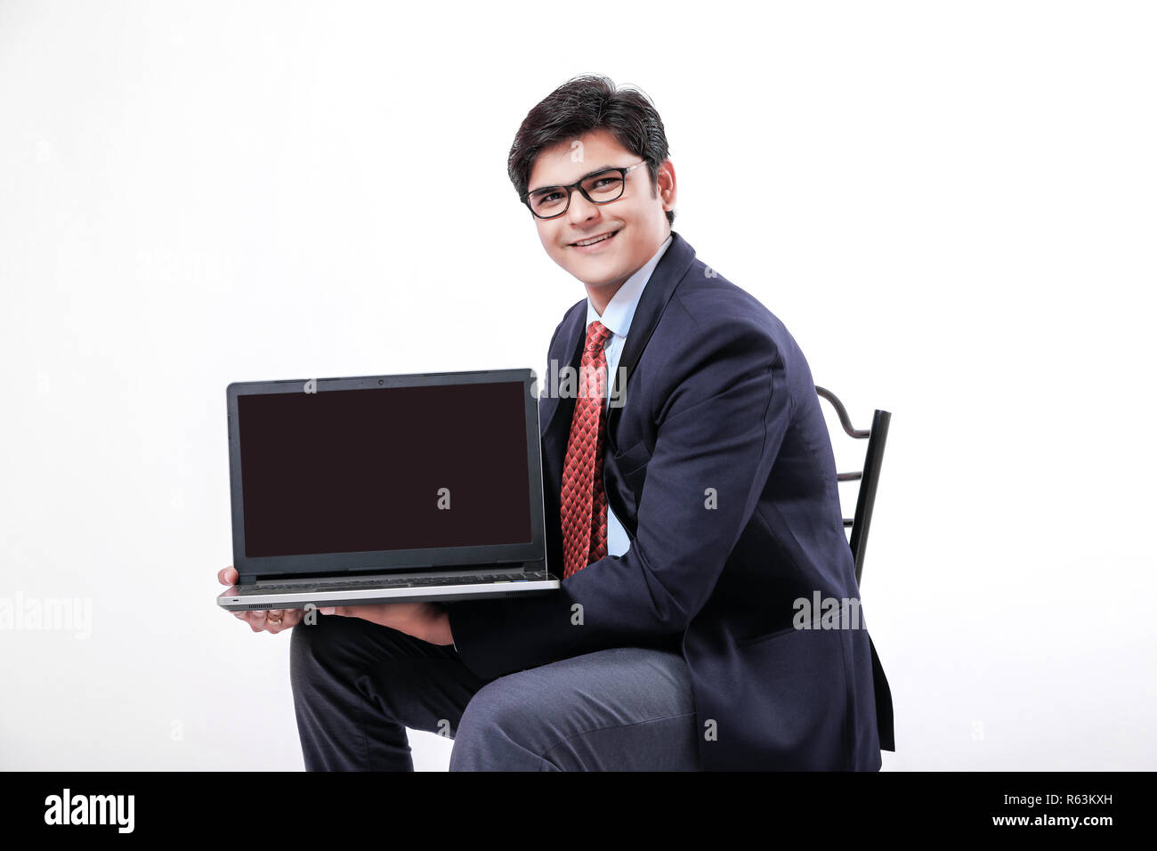Indian man with laptop hi-res stock photography and images - Alamy