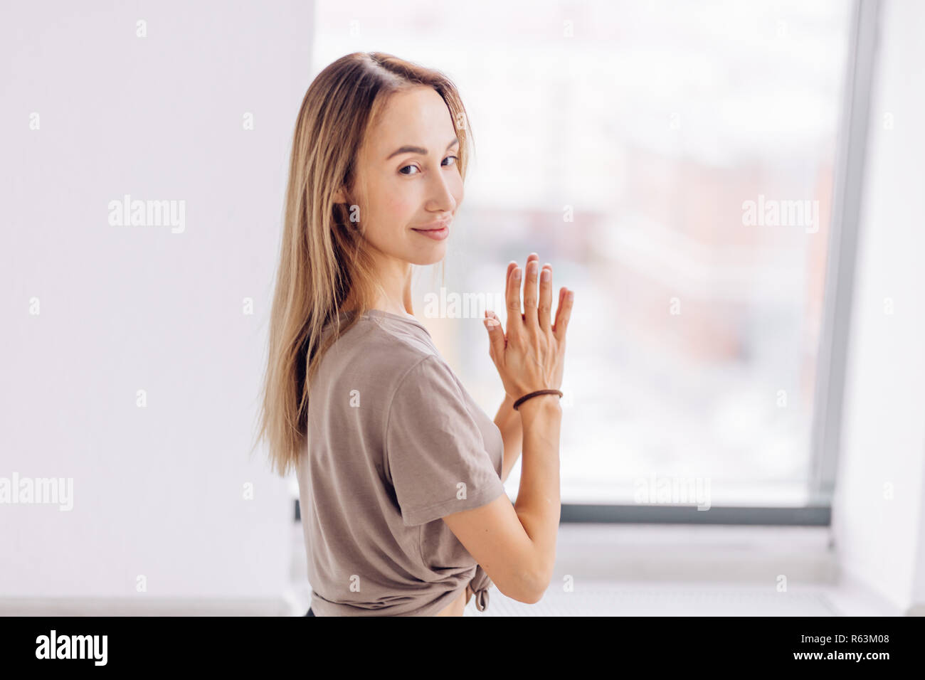 awesome smiling girl standing in greeting pose. customes and traditions ...