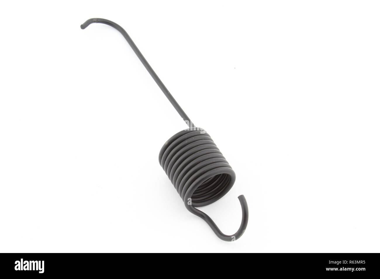 Steel spring, washing machine part Stock Photo - Alamy
