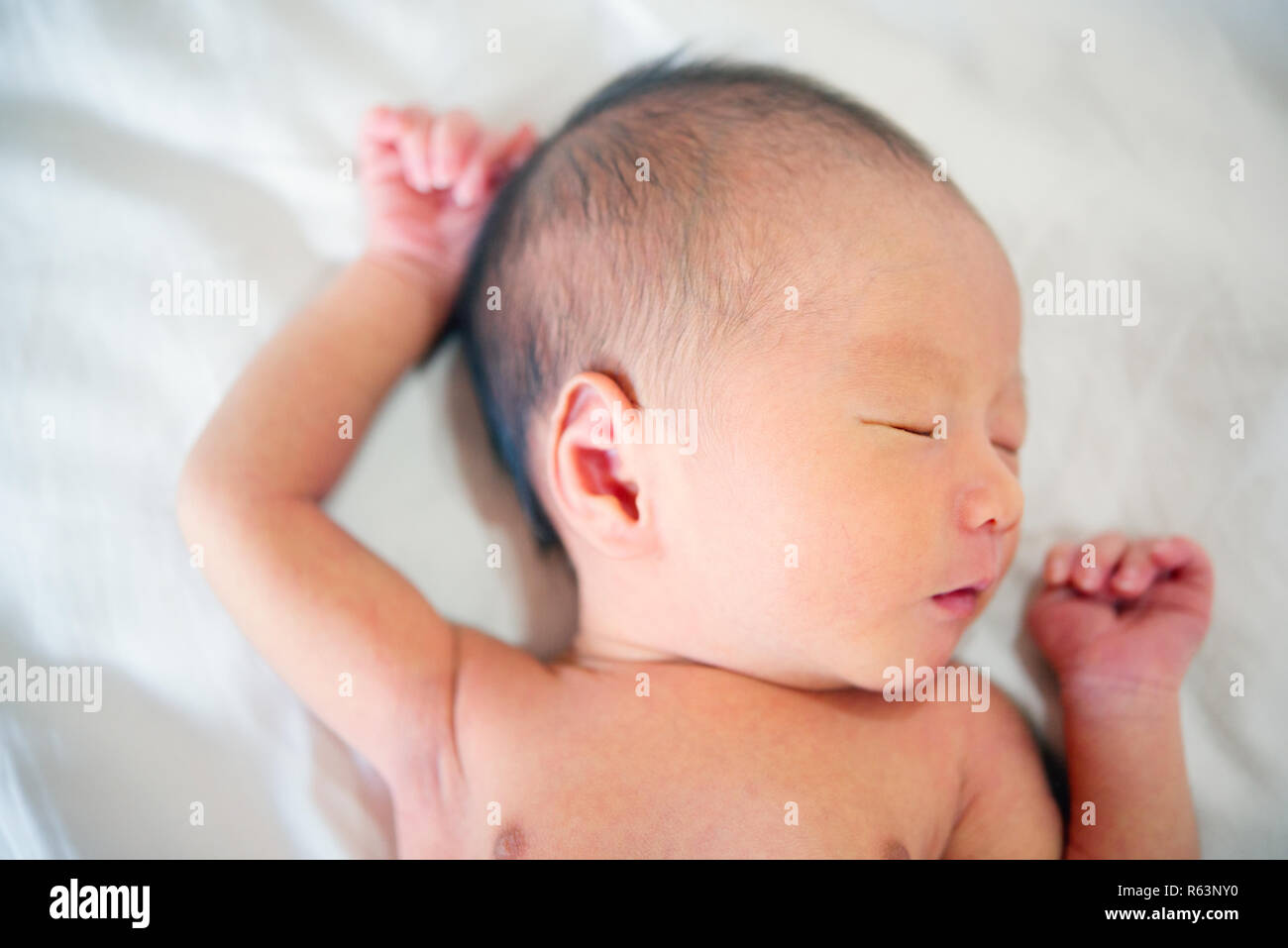Asian newborn baby sleeping Stock Photo - Alamy