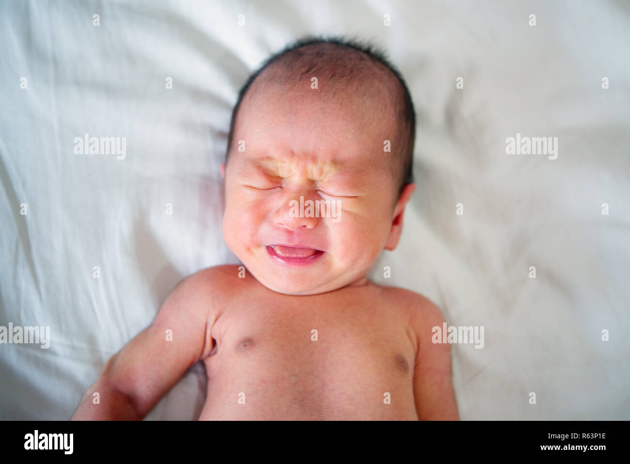 Newborn baby boy crying Stock Photo - Alamy