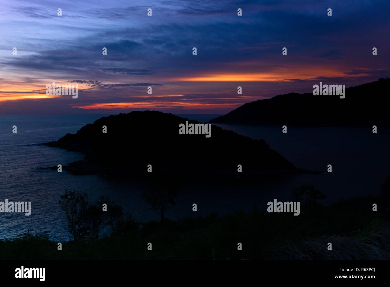 sunset on the island ko man in phuket Stock Photo - Alamy