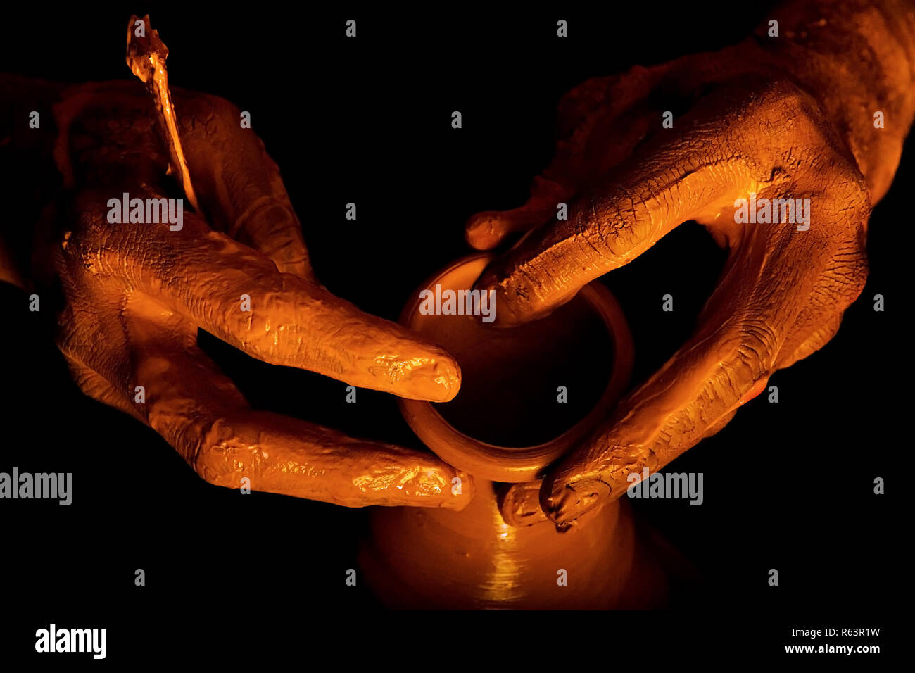 Closeup of potter sculpting a clay pot. Modeling clay close-up. Shows ...