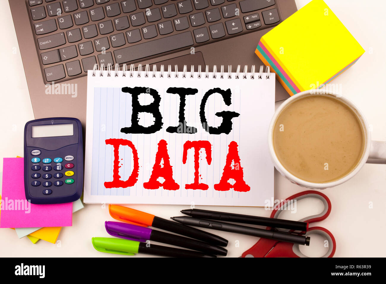 Word writing Big Data in the office with surroundings such as laptop ...