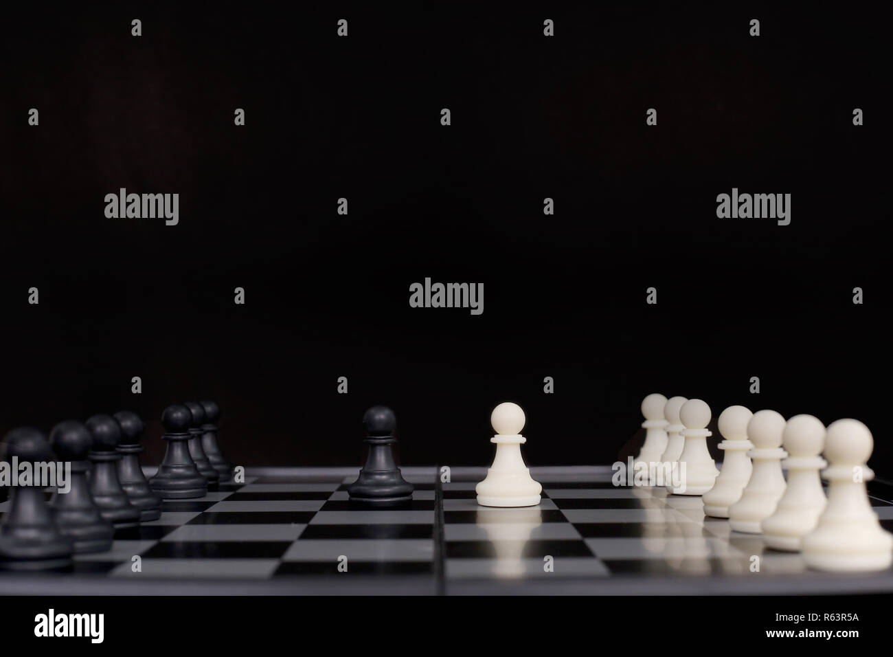 Picture of chess pawns on the chessboard. isolated on the black ...