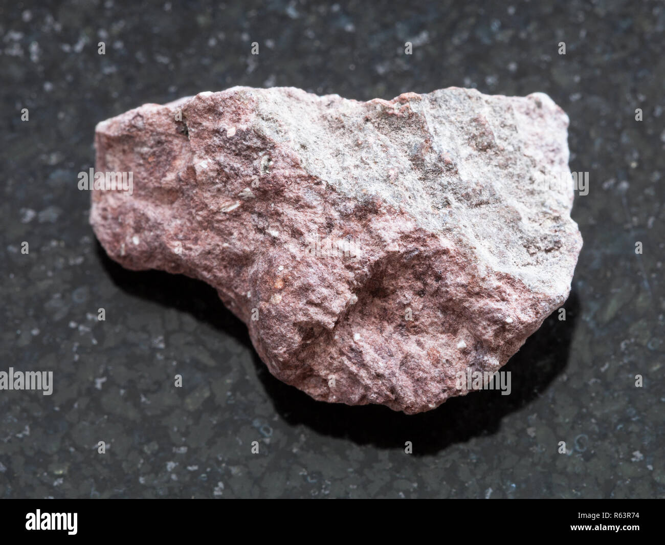 Ash Tuff rough stone on dark background Stock Photo - Alamy