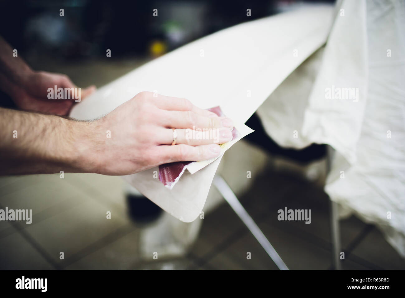 cleaning spoiler. preparation for painting, machine parts Stock Photo ...