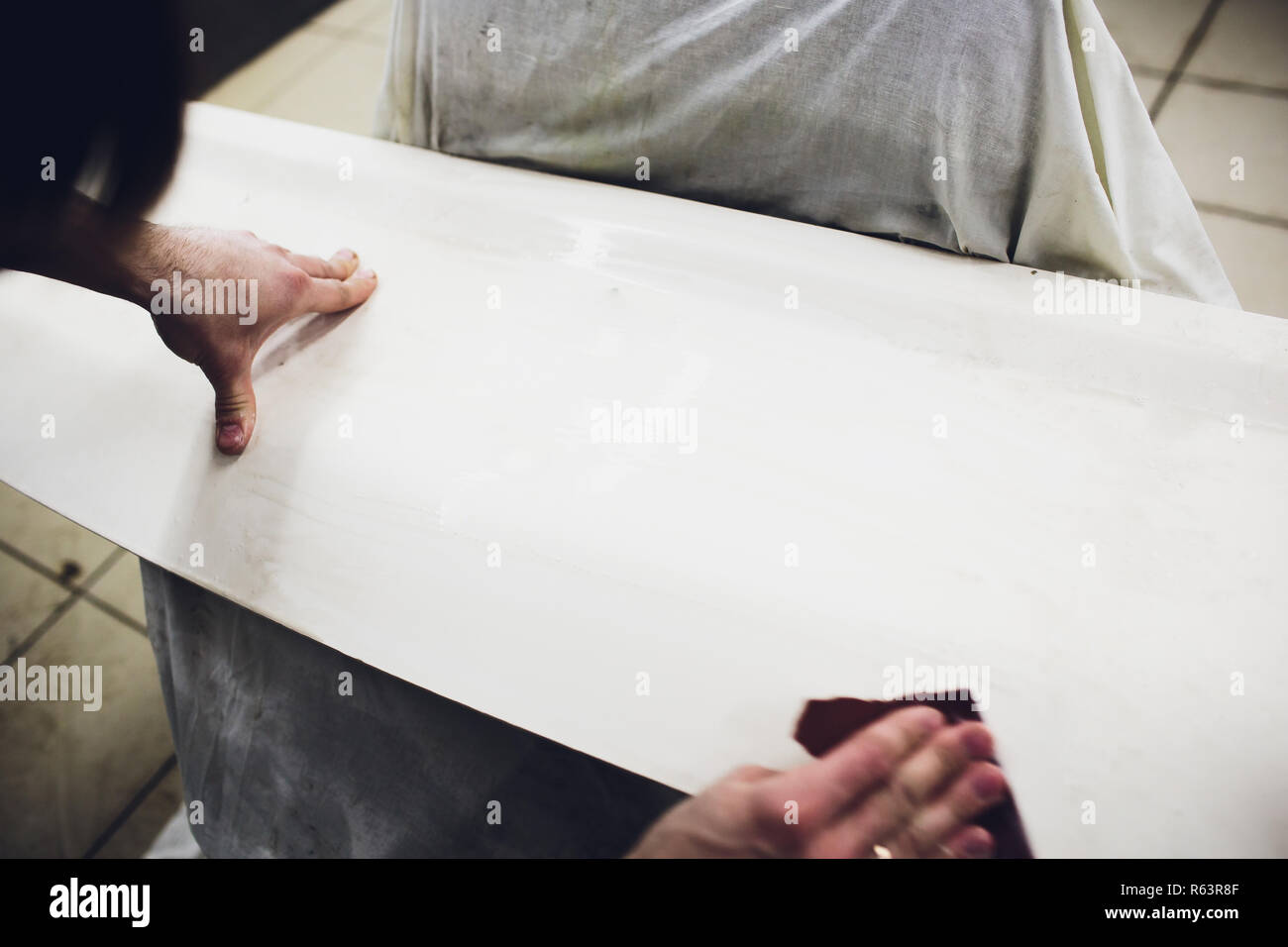 cleaning spoiler. preparation for painting, machine parts Stock Photo ...