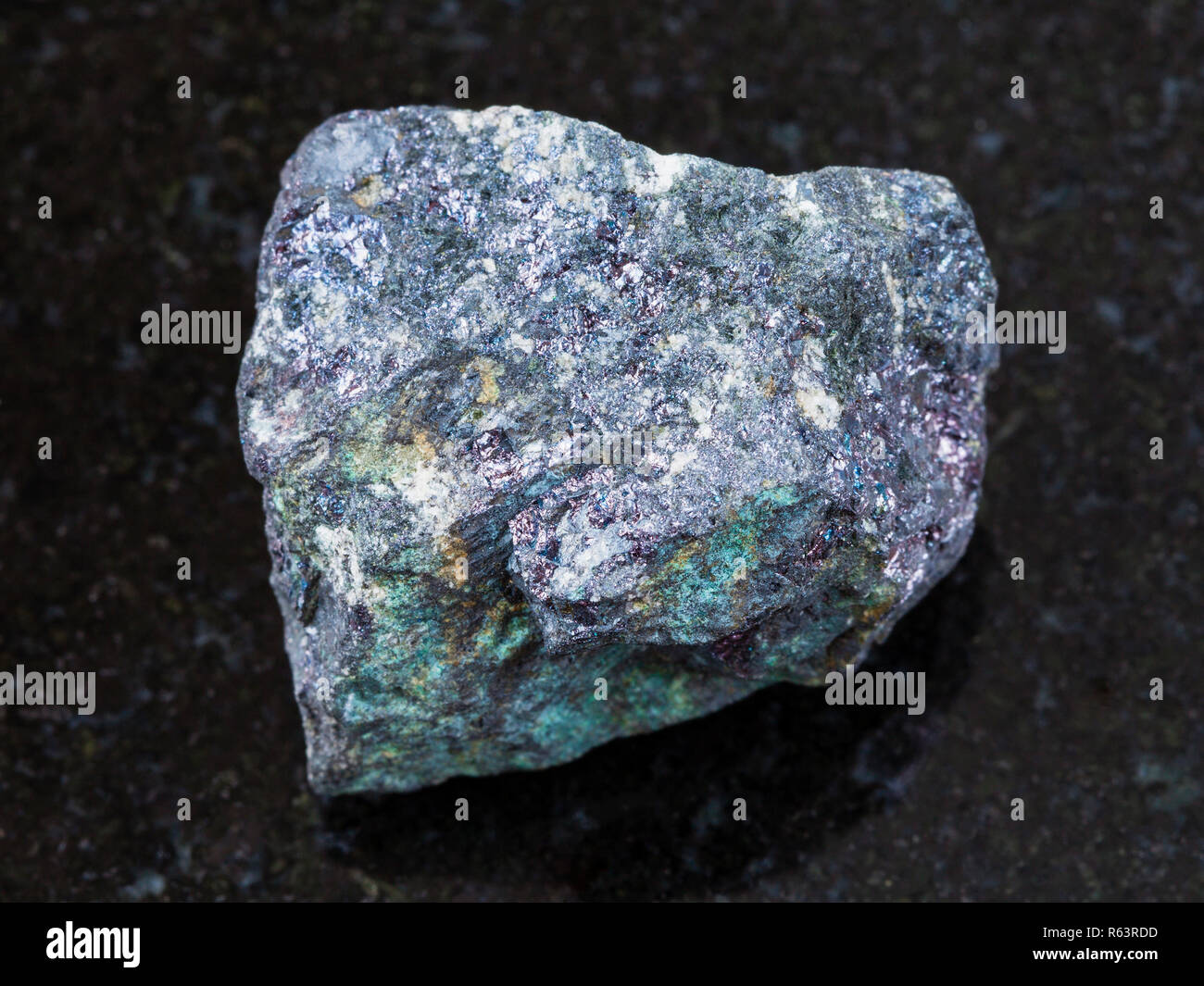 raw bornite stone on dark background Stock Photo - Alamy