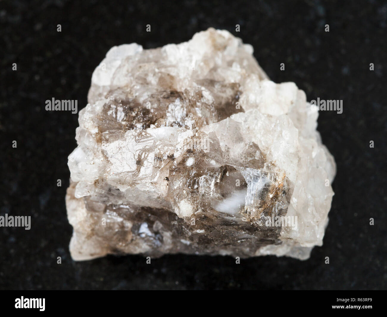 raw Halite (rock salt) stone on dark background Stock Photo - Alamy
