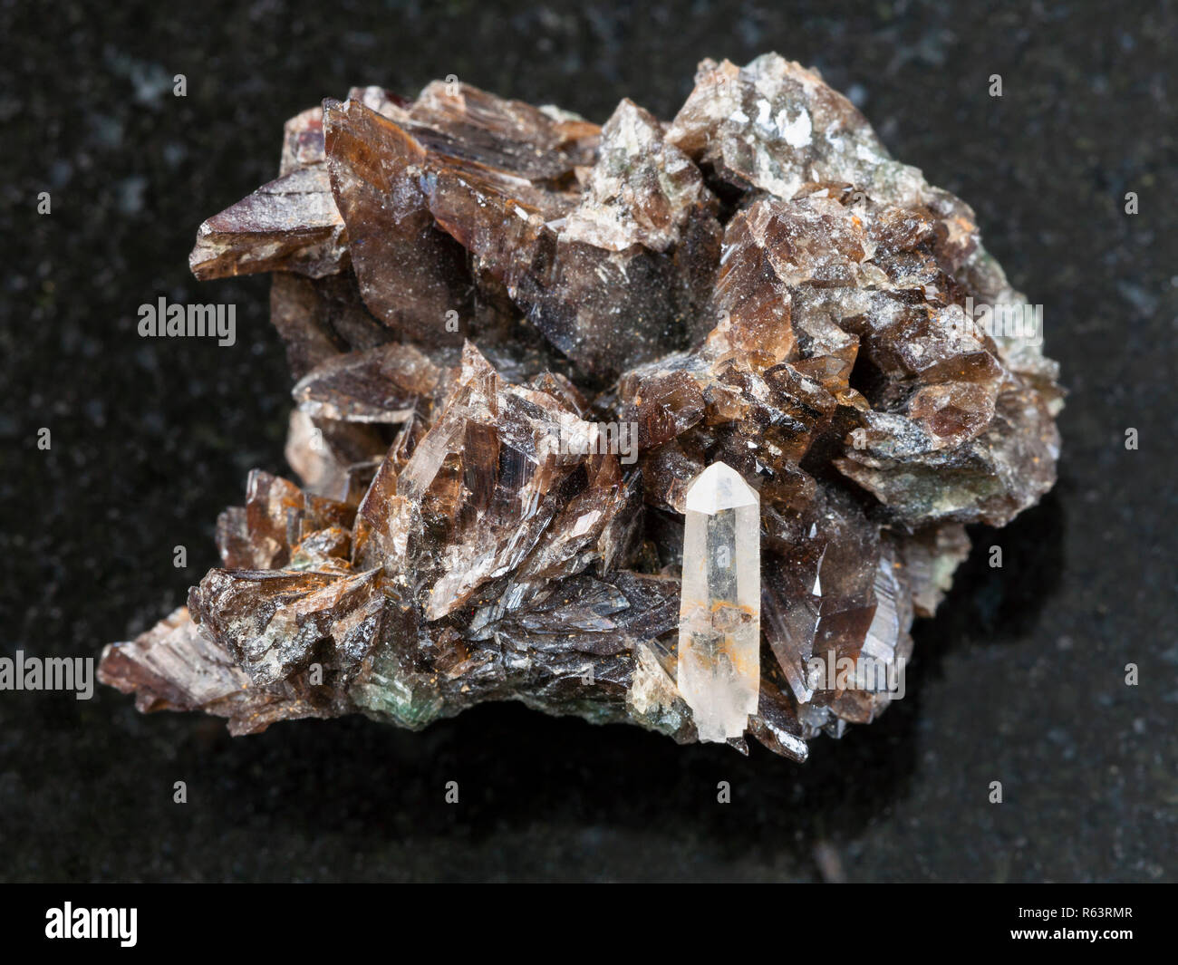 raw crystals of axinite stone on dark background Stock Photo - Alamy