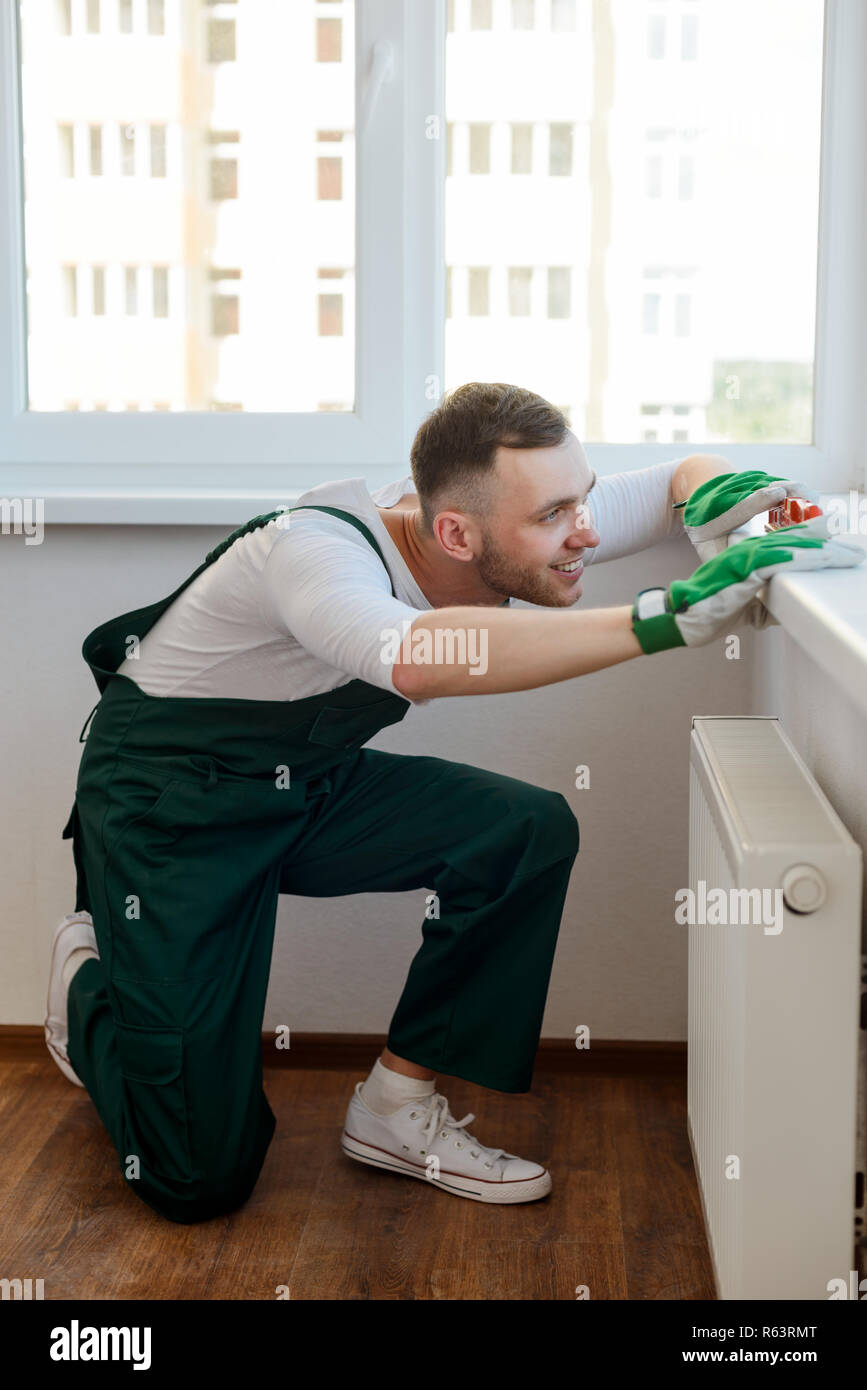Foreman using a level tool Stock Photo - Alamy