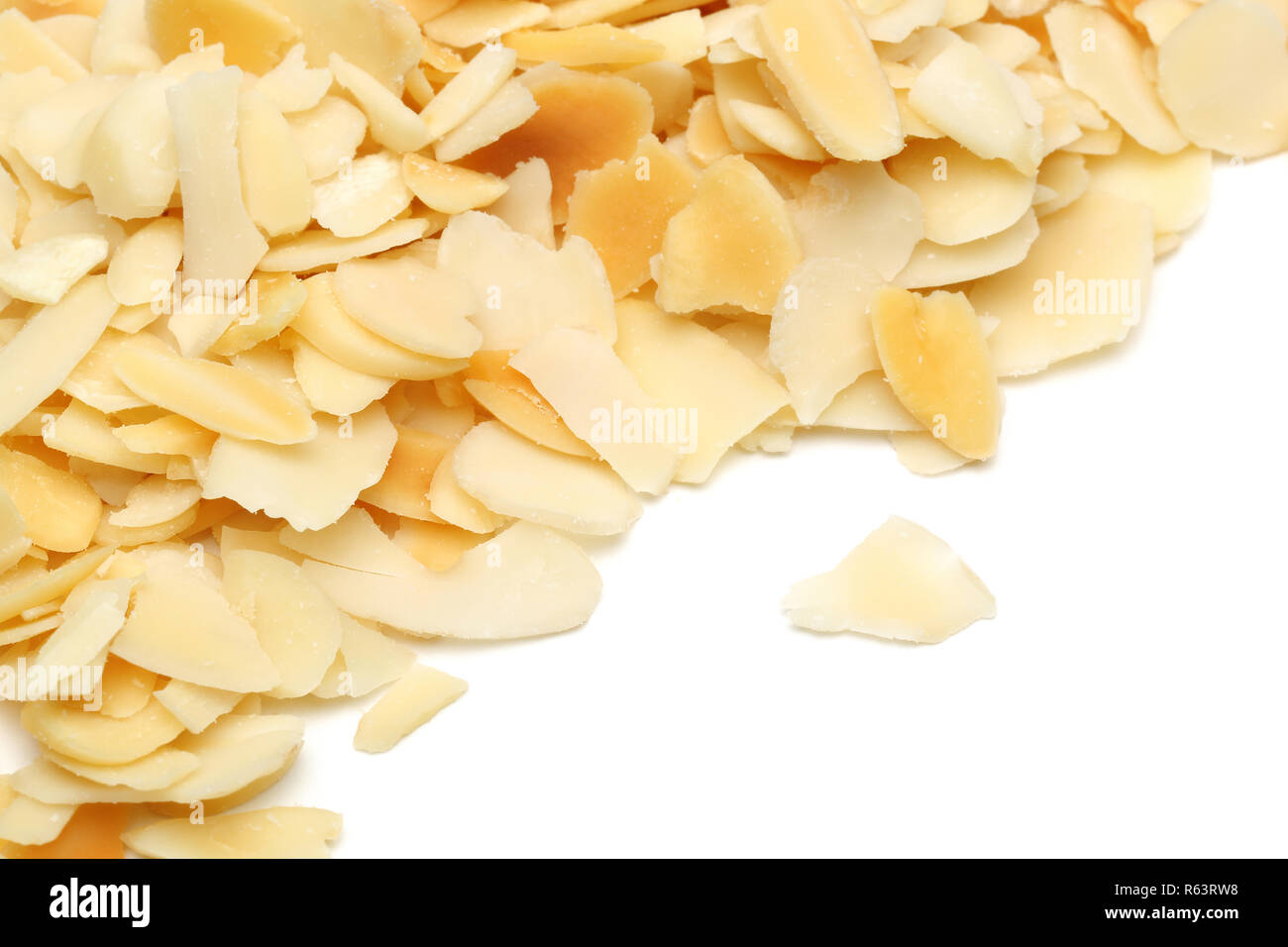 Almond flakes scattered on white background. Studio shot Stock Photo ...