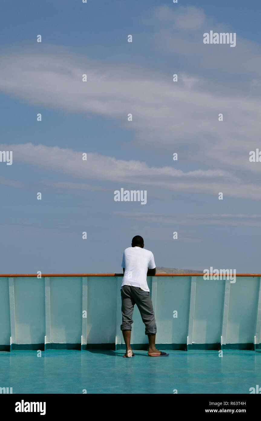 african man standing on the stern of a ship Stock Photo - Alamy