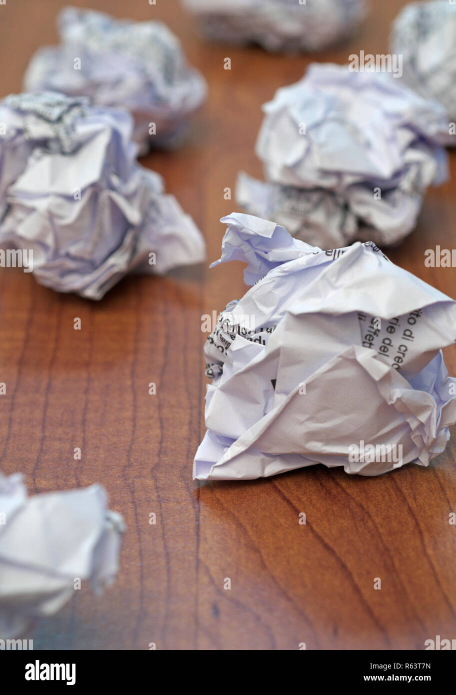 crumpled paper balls on desk Stock Photo - Alamy