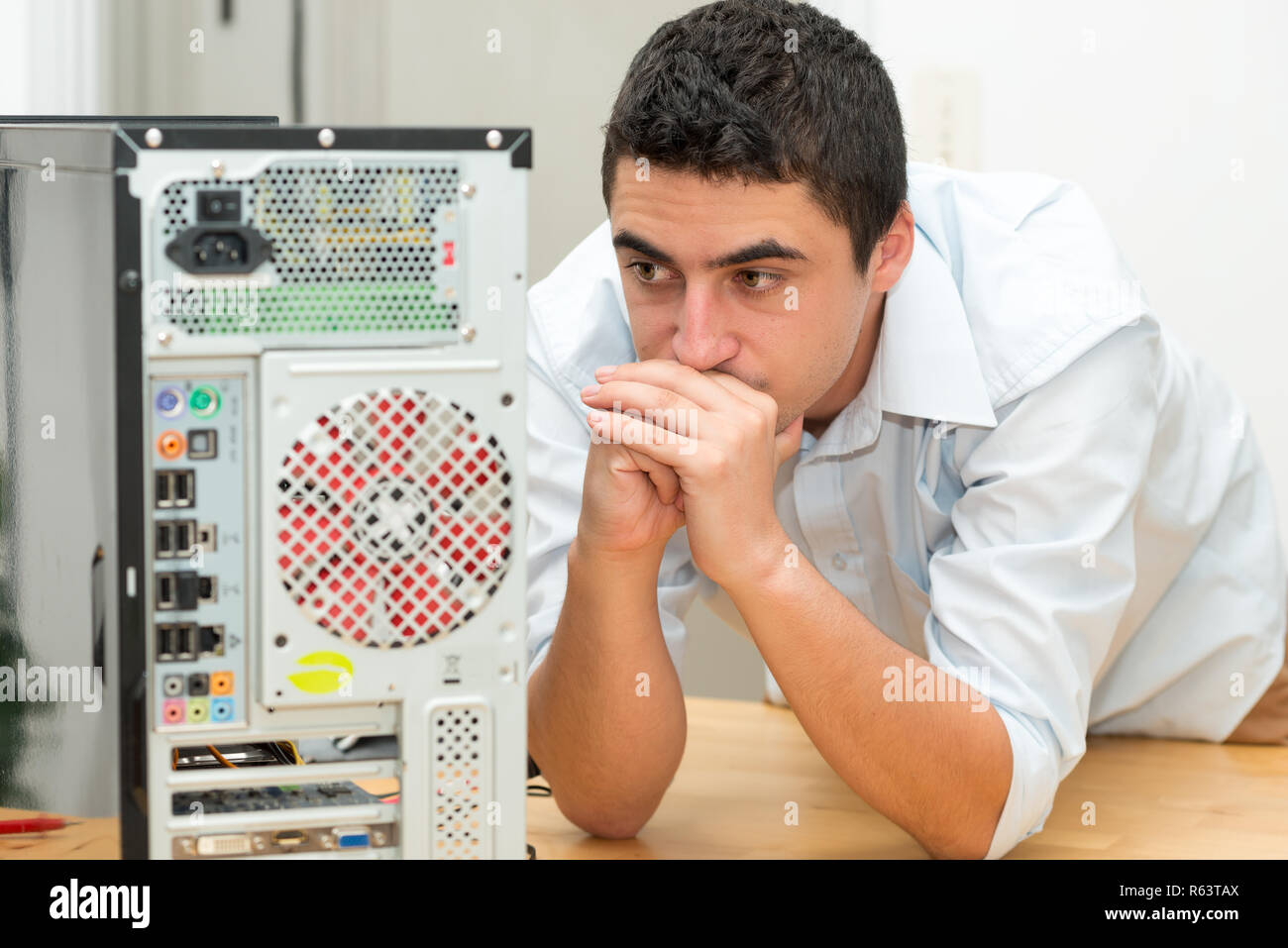 young technician have a problem with computer Stock Photo - Alamy