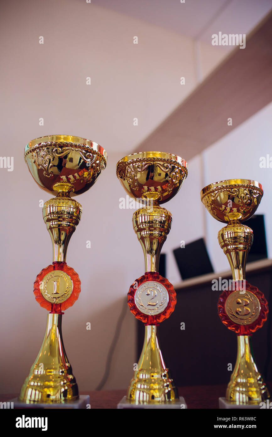 three different kind of golden trophies Stock Photo - Alamy