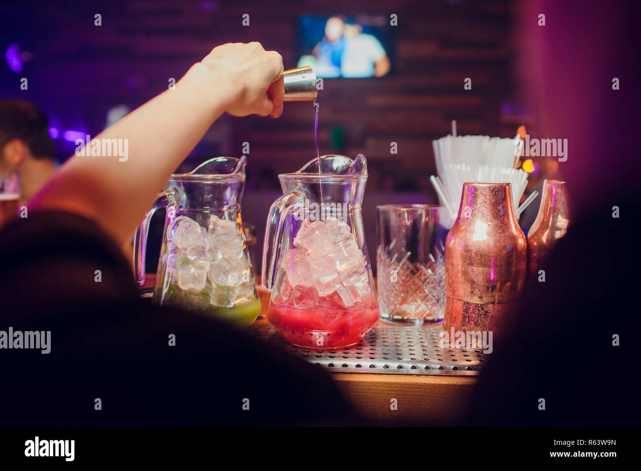 Glasses alcohol color cocktails on bar background Stock Photo - Alamy