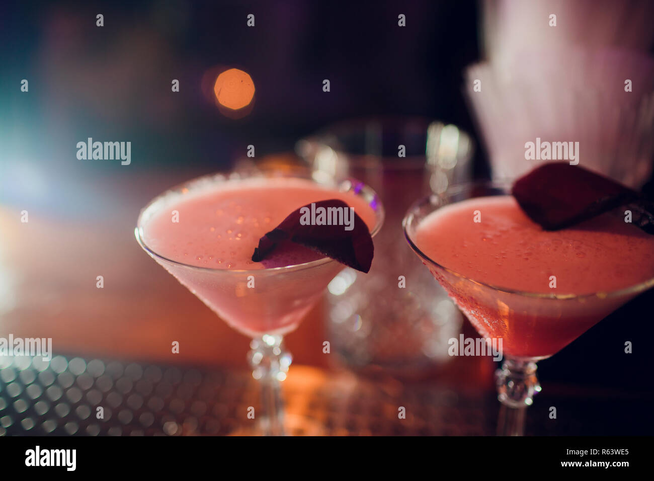 Glasses alcohol color cocktails on bar background Stock Photo - Alamy