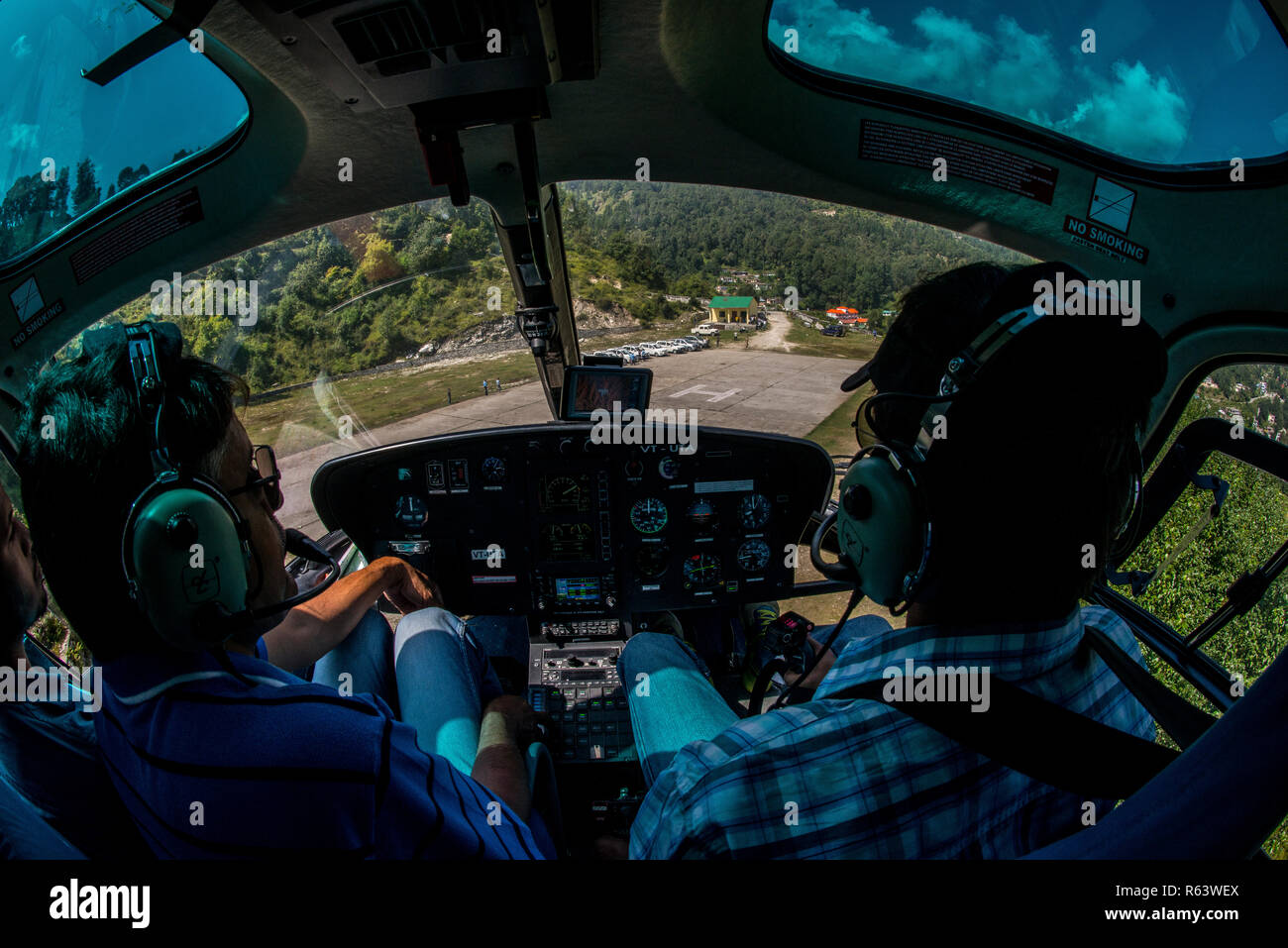 A helicopter approaches the helipad in the village of Munsiyari in ...