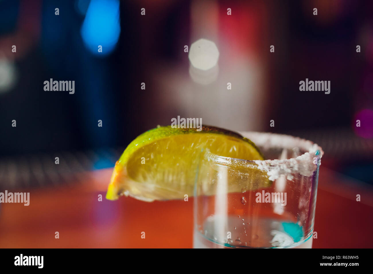Glasses alcohol color cocktails on bar background Stock Photo - Alamy
