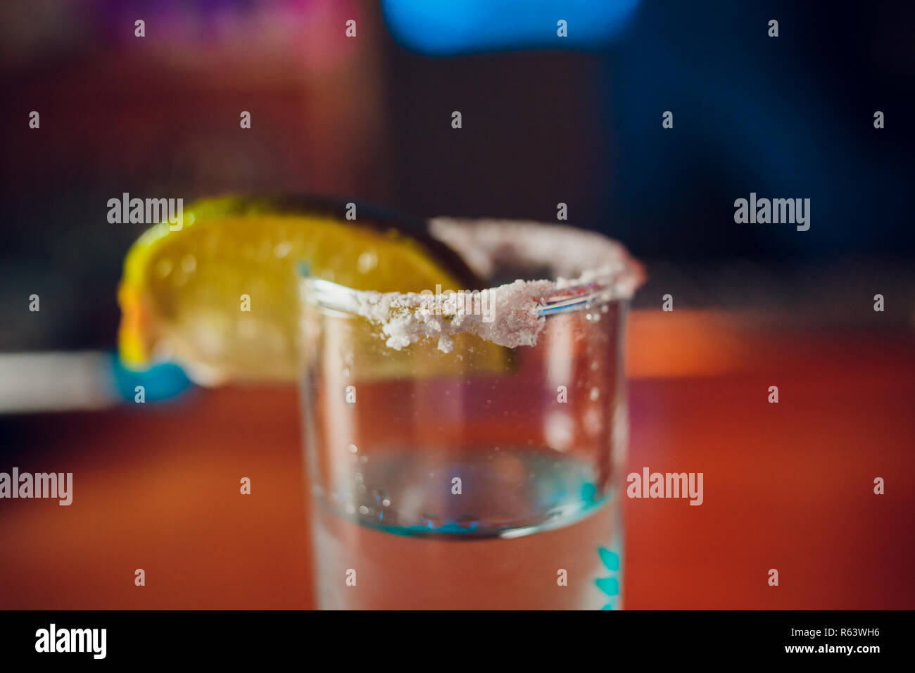 Glasses alcohol color cocktails on bar background Stock Photo - Alamy