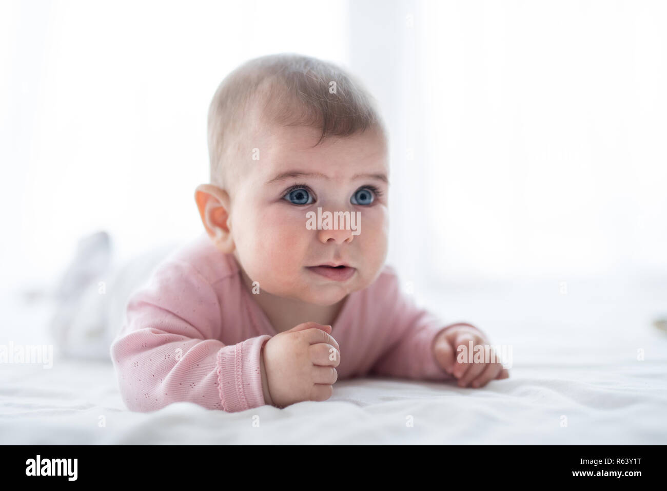 Sad girls lying on bed hi-res stock photography and images - Alamy
