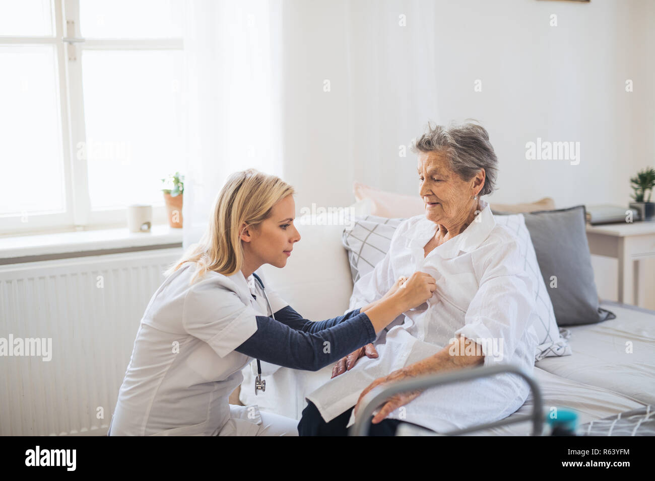 Helping the sick hi-res stock photography and images - Alamy