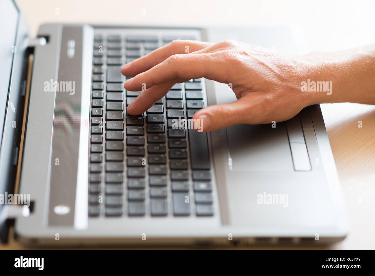 Men hand typing on a keyboard of laptop Stock Photo - Alamy