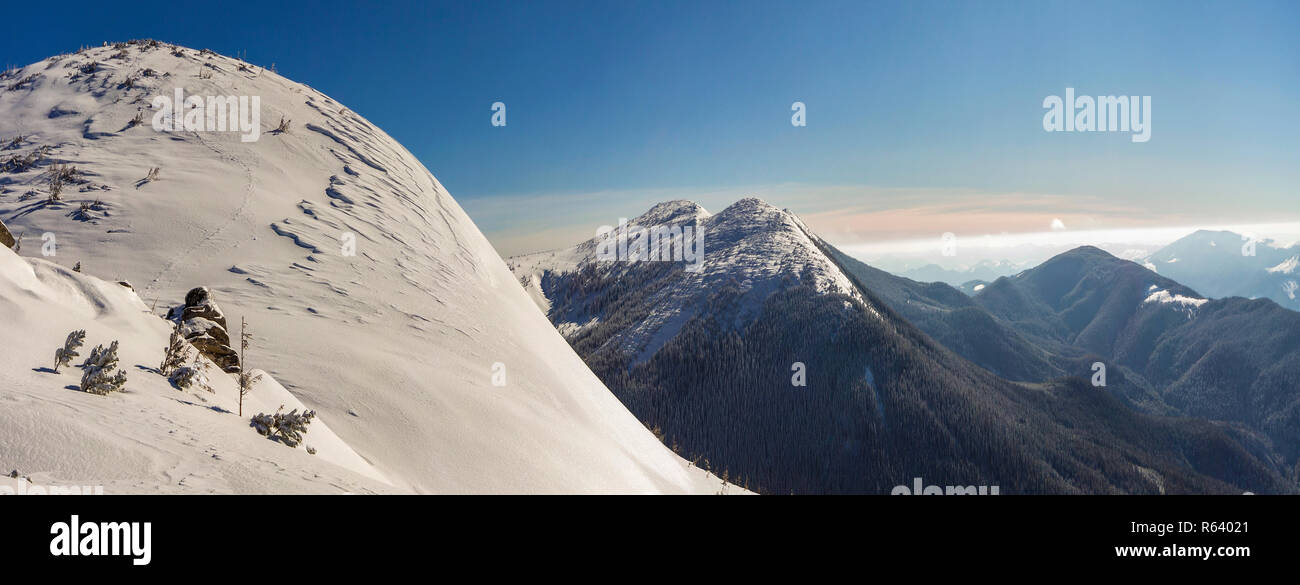 Beautiful winter landscape. Steep mountain hill slope with white deep ...
