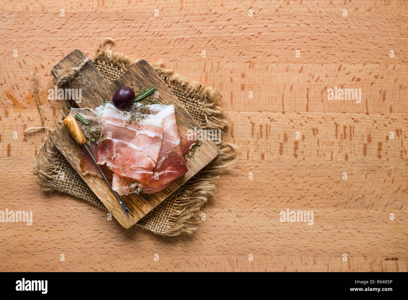 Buffet snack appetizer with small speck chopping board Stock Photo - Alamy
