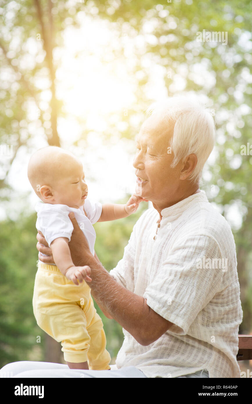 Grandfather playing with grandson at outdoor Stock Photo - Alamy
