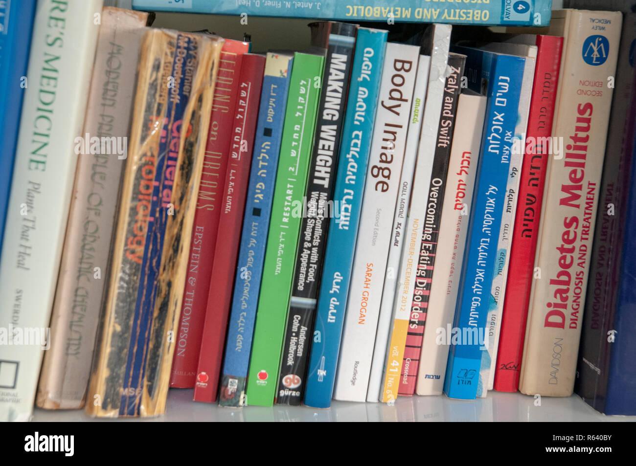Bookshelf in a medical professional's consulting room Stock Photo - Alamy