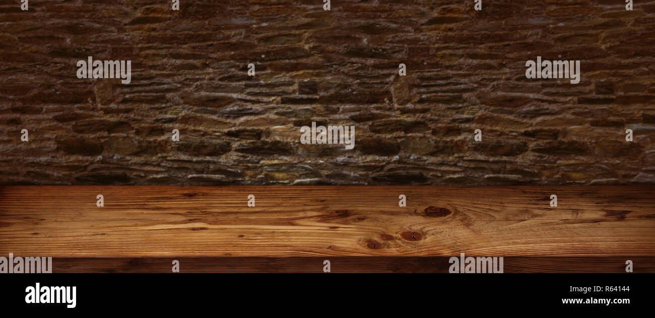rustic wooden table with stone wall Stock Photo - Alamy