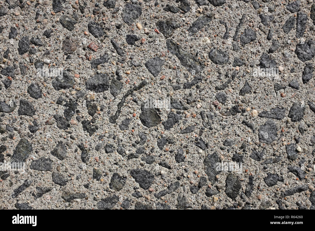 Exposed aggregate concrete paving background Stock Photo - Alamy
