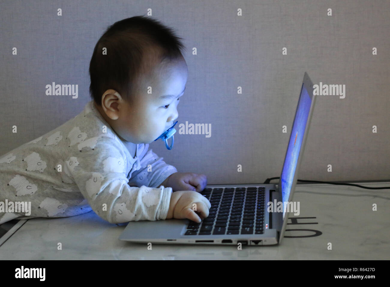 Childcare worker baby hi-res stock photography and images - Alamy