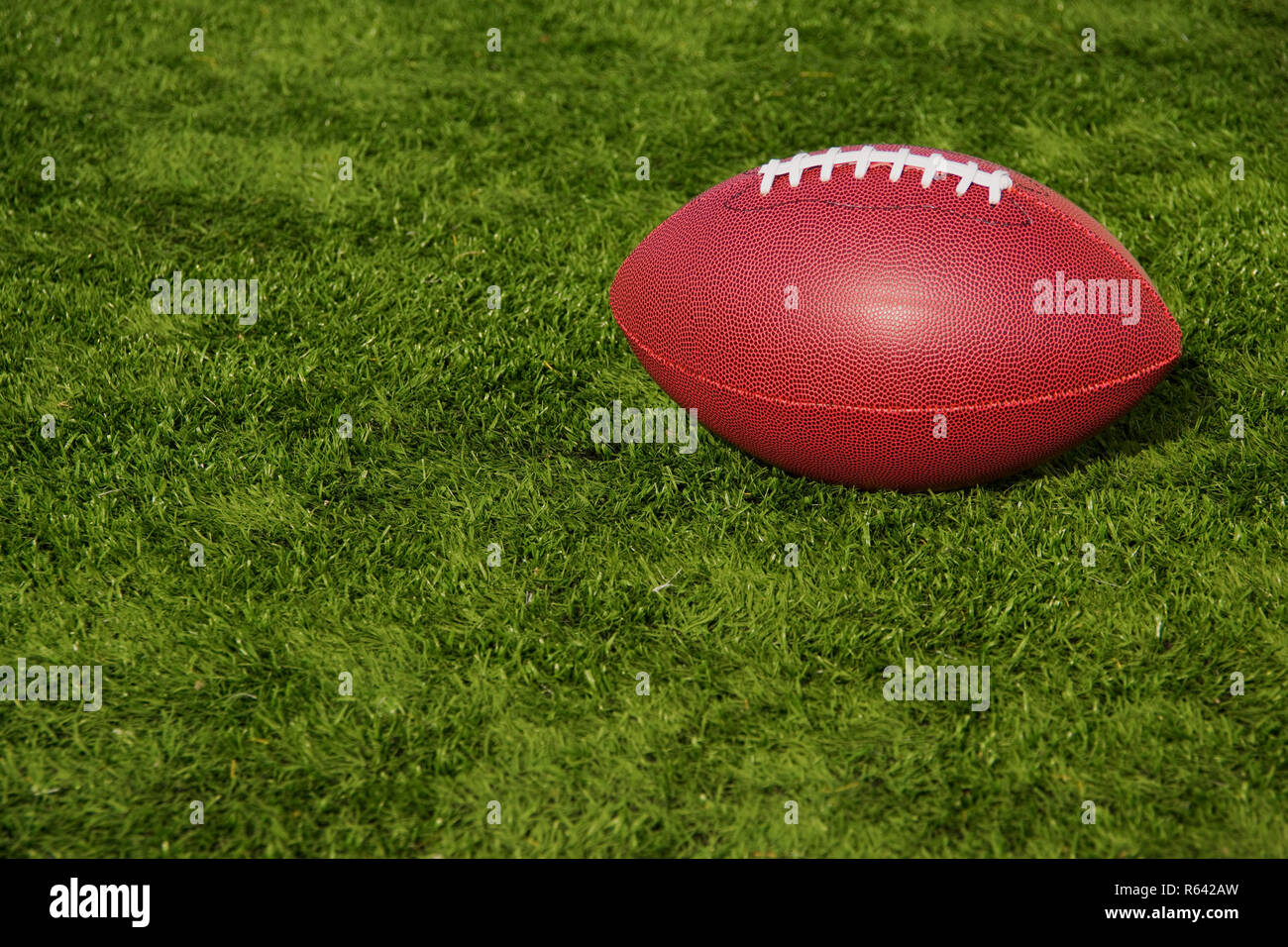 Football Resting on Artificial Turf Stock Photo - Alamy