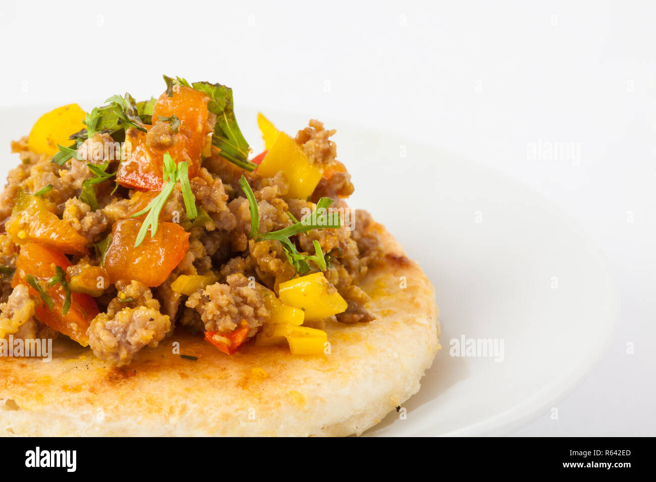 Traditional Colombian arepa topped with ground beef Stock Photo - Alamy