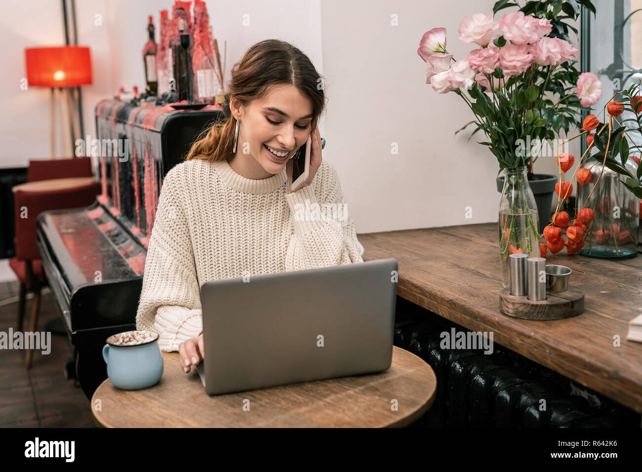 Woman working remotely from cafe hi-res stock photography and images ...