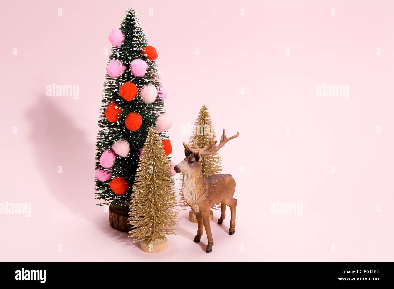 christmas trees and reindeer Stock Photo - Alamy