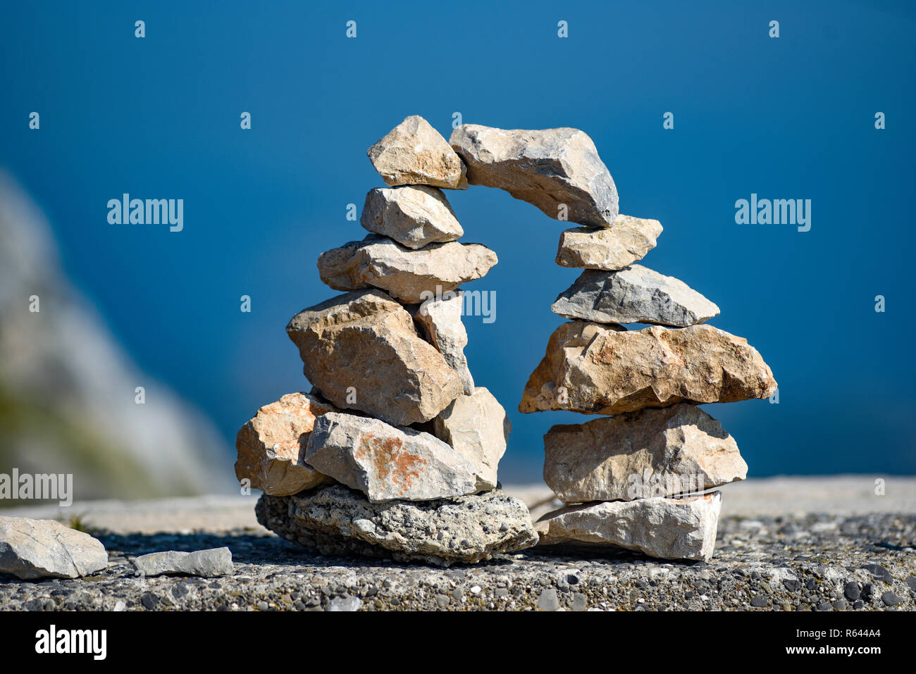 Pebbles stacked on top of each other forming an arc Stock Photo - Alamy