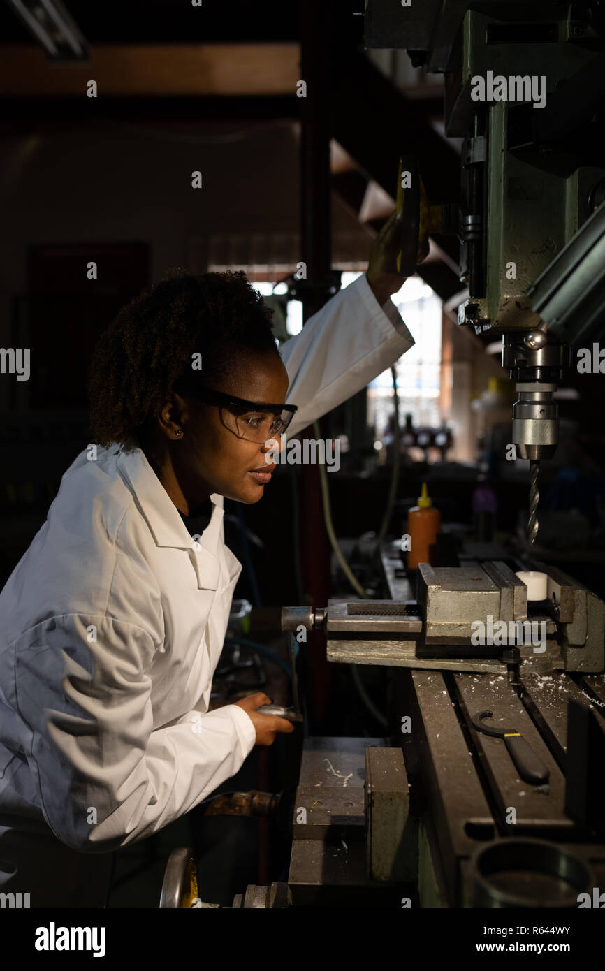 Female worker working in glass factory Stock Photo - Alamy