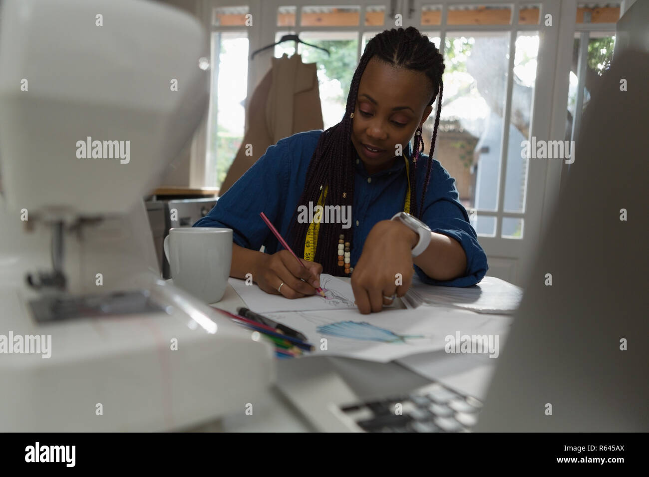 Sewing woman in work hi-res stock photography and images - Alamy