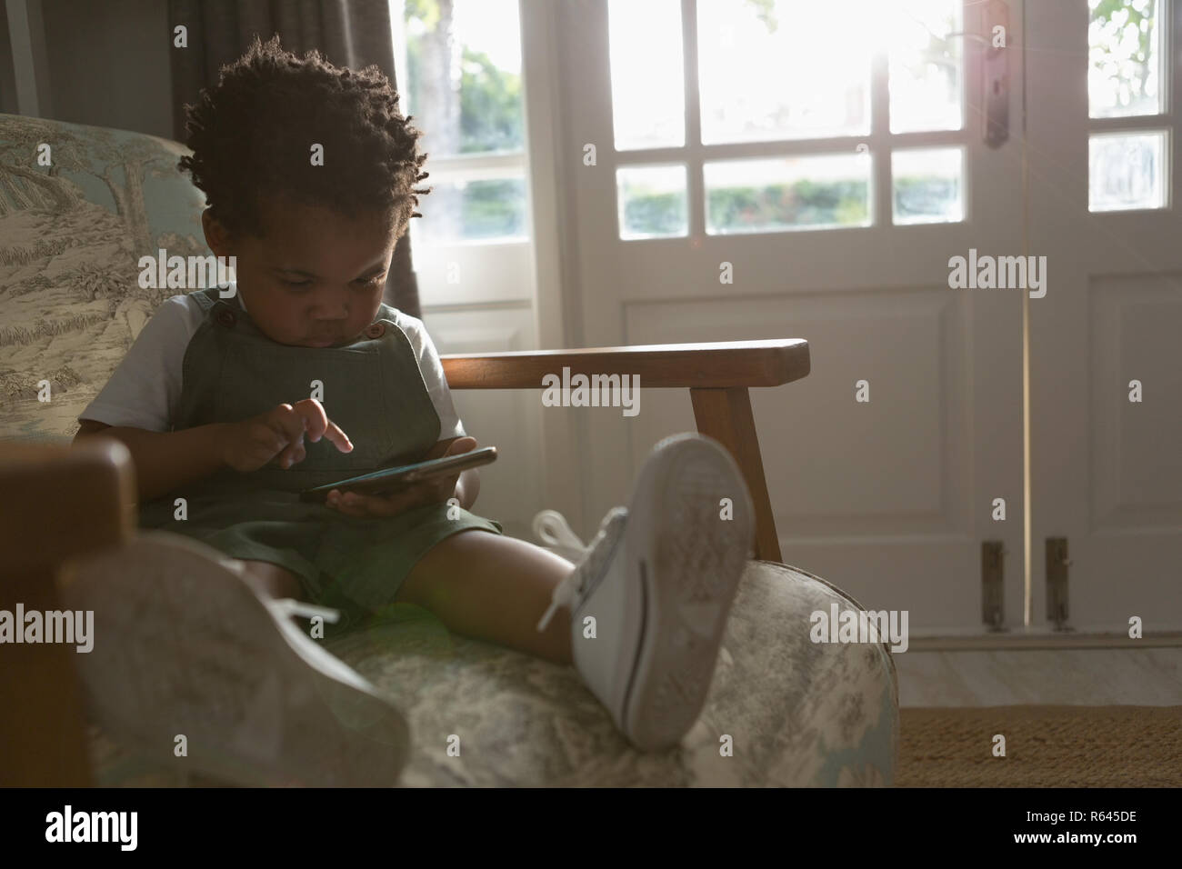 Child using mobile phone Stock Photo - Alamy