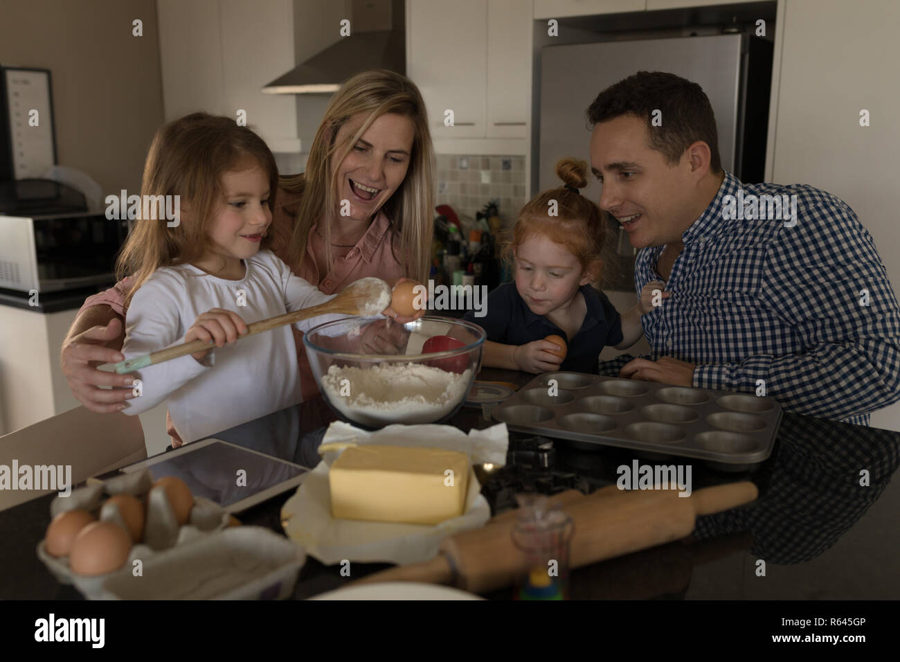 Adorable family cooking together hi-res stock photography and images ...