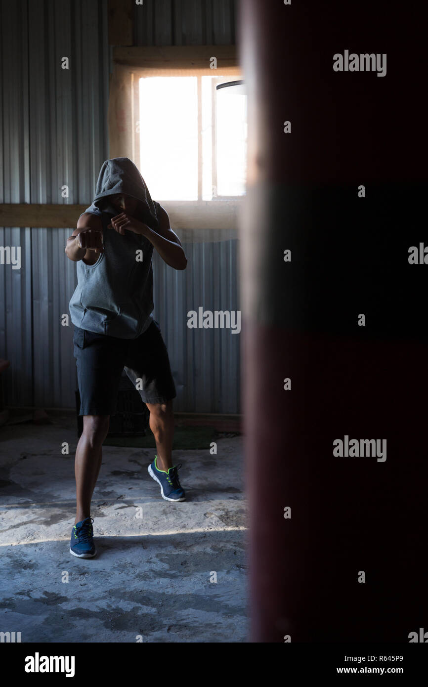 Male boxer practicing boxing in fitness studio Stock Photo - Alamy
